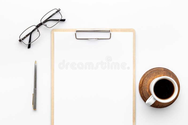 White Office Desk Table with Empty Paper on Clipboard Stock Photo ...
