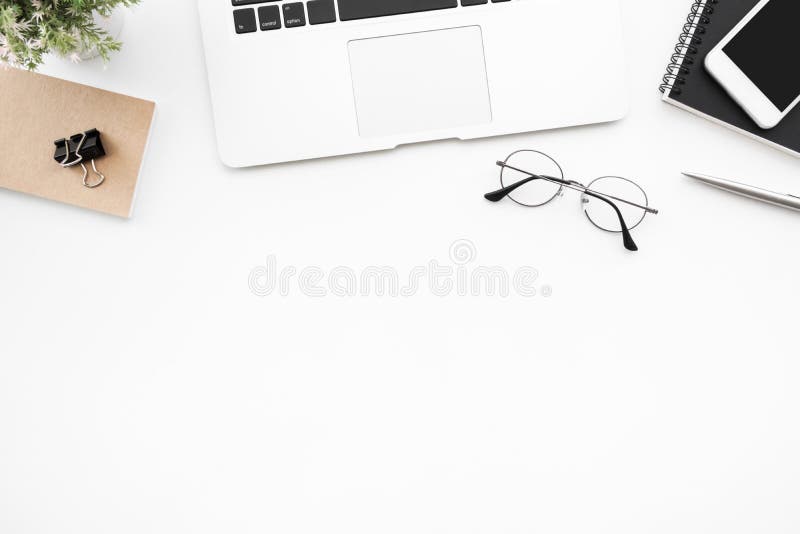White Office Desk Table with Laptop Computer, Smartphone and Supplies ...
