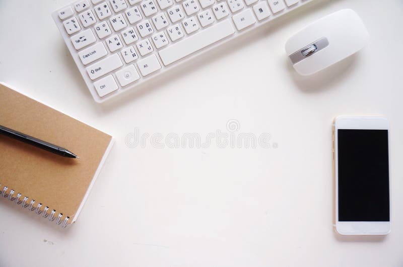 White Office Desk Table with a Lot of Things on it. Stock Photo - Image ...