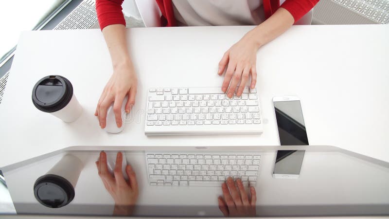White Office Table and Woman Working on Computer. Top View. Typing on ...