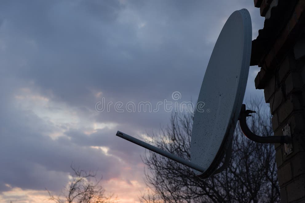 White Old Satellite Dish on House Sunset Stock Photo - Image of ...