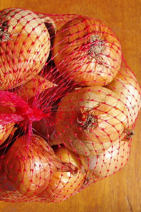 Onions in a Packing Net Isolated on White Background Stock Image ...
