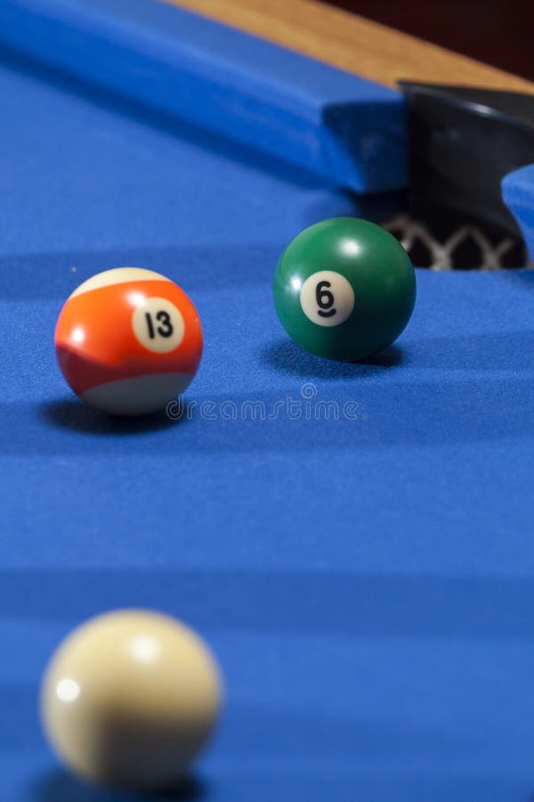 White, Orange and Green Billiard Balls in a Pool Table Stock Photo ...