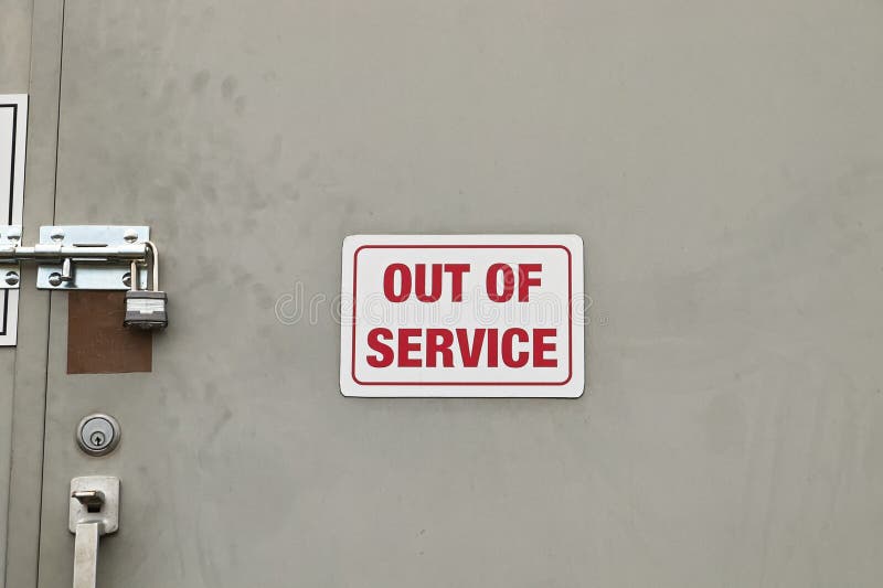 A White Out of Service Sign on a Locked Door Stock Image - Image of ...