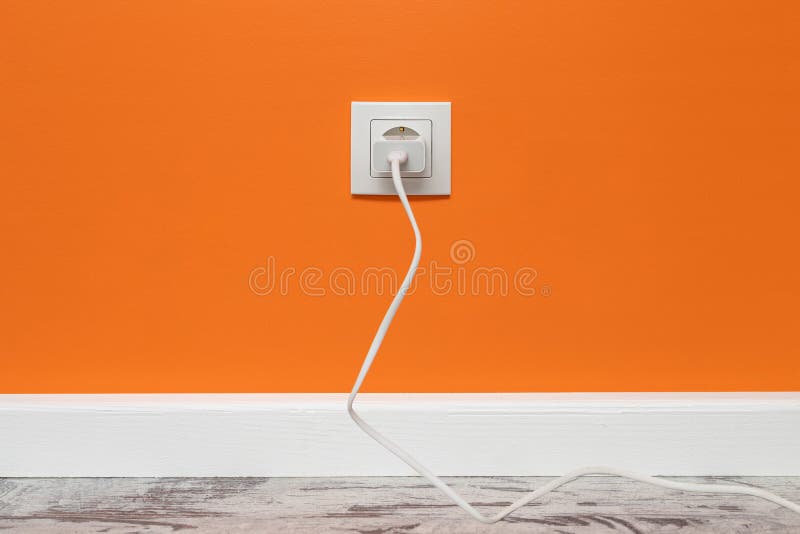 White Outlet on Orange Wall Stock Image - Image of front, room: 294586459