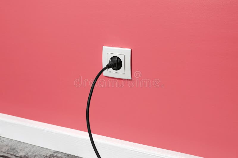 White outlet on pink wall stock photo. Image of house - 291622234