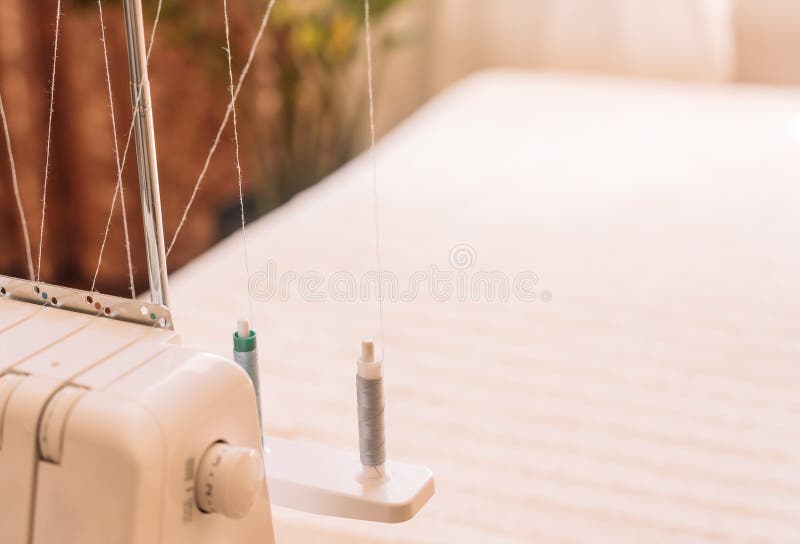 White Overlock Machine with Threads Close-up Stock Photo - Image of ...