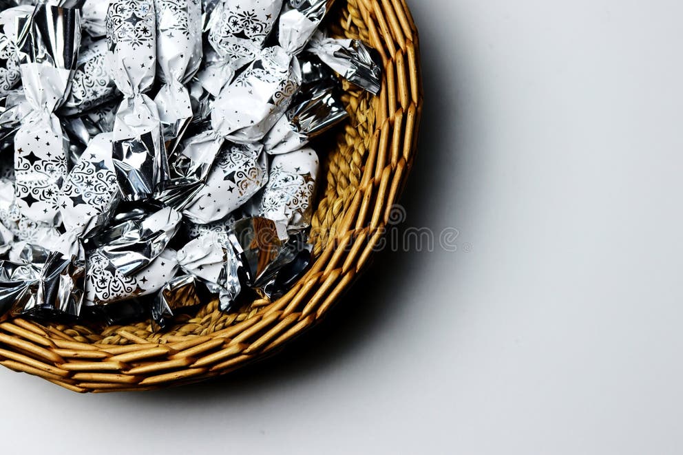 White Packaged Christmas Candies in a Basket Stock Photo - Image of ...