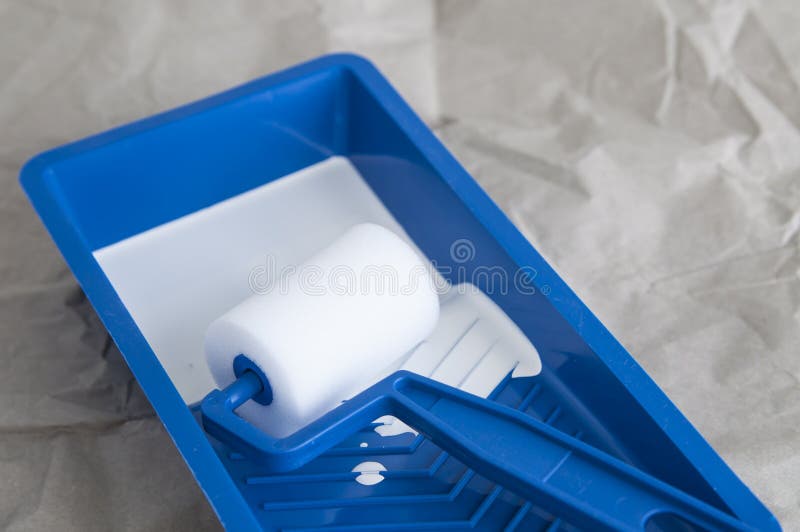 White Paint in Blue Tray with Paint Roller Stock Image - Image of blue ...