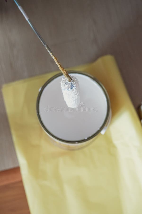 White Paint in a Container. Painting Wall Project Stock Image - Image ...