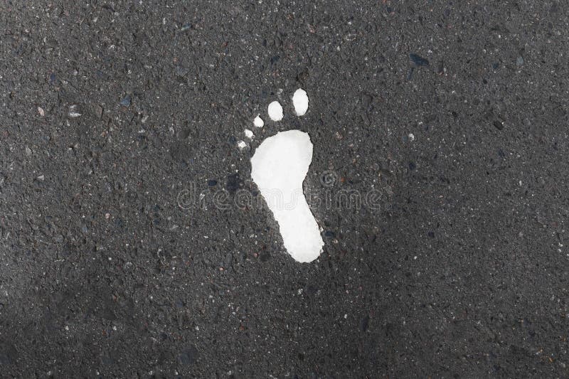 White Paint of Footsteps on the Asphalt Road Stock Photo - Image of ...