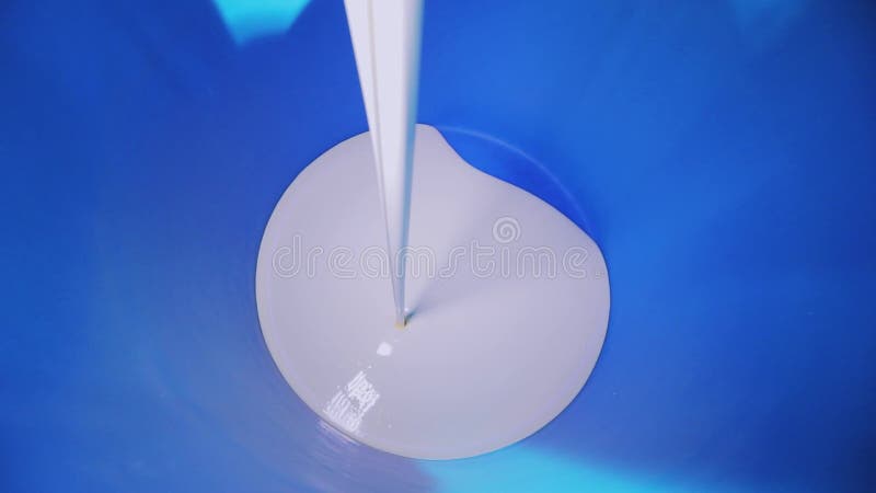White Paint is Poured into the Barrel, the Process of Pouring Paint on ...