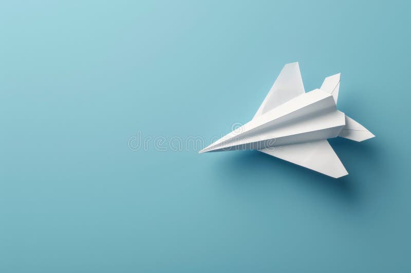 A White Paper Airplane on a Light Blue Background Creating a Minimalist ...