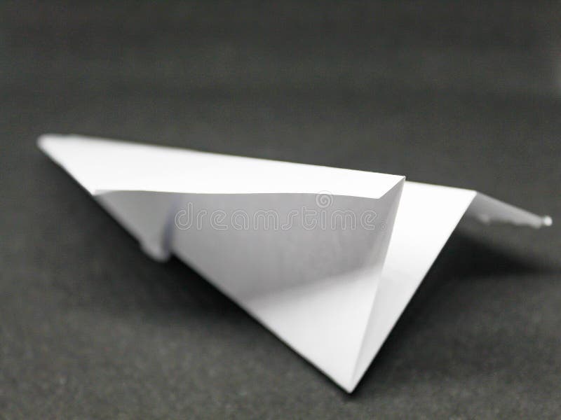 White Paper Airplane Toy on Black Background Stock Photo - Image of ...