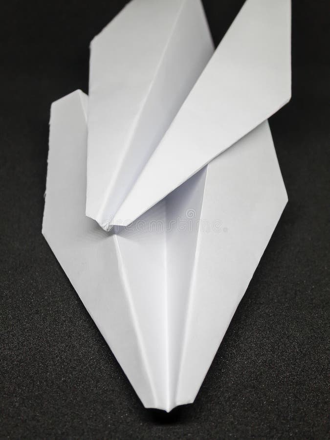 White Paper Airplane Toy on Black Background Stock Image - Image of ...