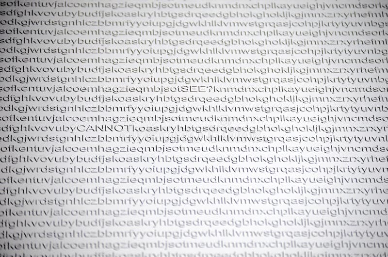 White Paper Background with Random Letters of the English Alphabet ...