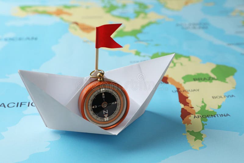 White Paper Boat with Compass on World Map Stock Photo - Image of ...