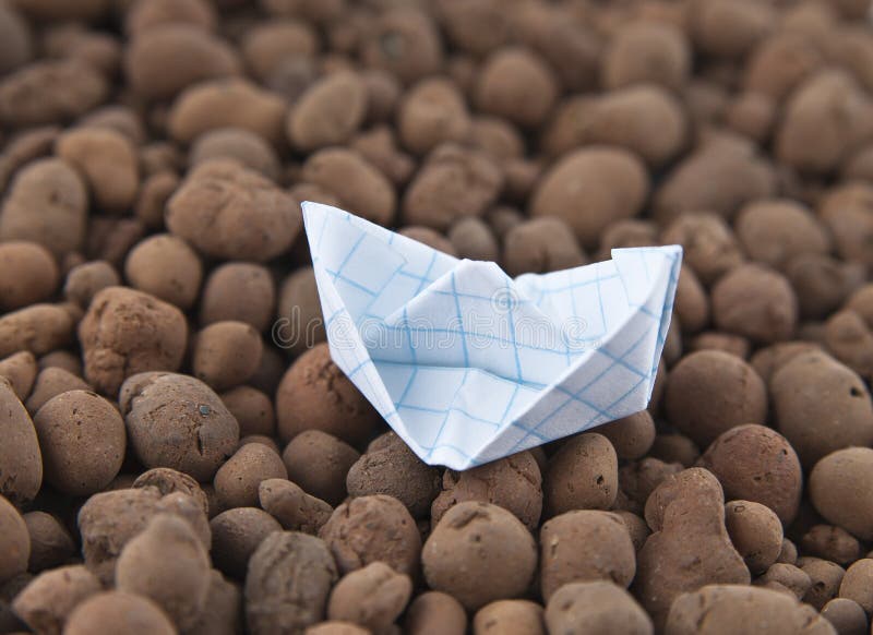 White Paper Boat On The Rocks Stock Photo - Image of notebook, white ...
