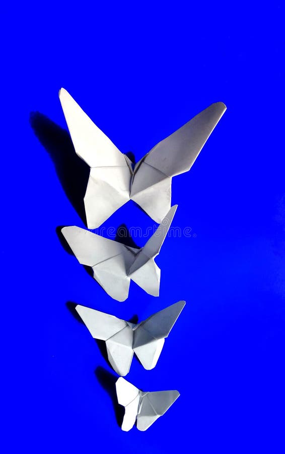 White Paper Butterflies on Blue Background. Decorative Concept Stock ...