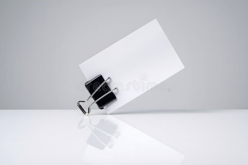 White Paper Clipped by Black Binder, Glossy Reflection Adds Sleek ...