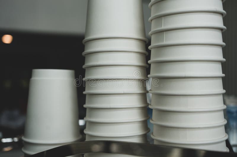 White Paper Coffee Cup Stacking in Rows Above Coffee Machine Stock ...