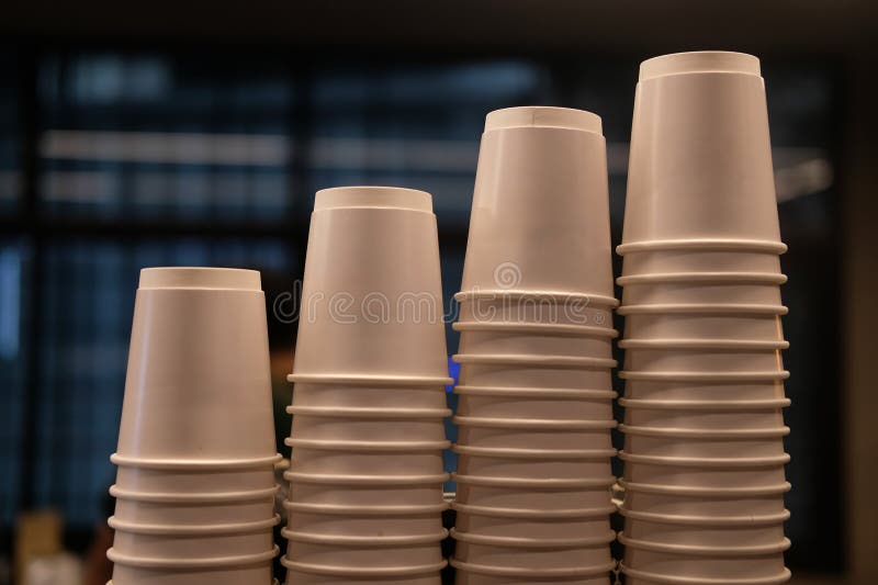 White Paper Coffee Cup Stacking in Rows Above Coffee Machine Stock ...