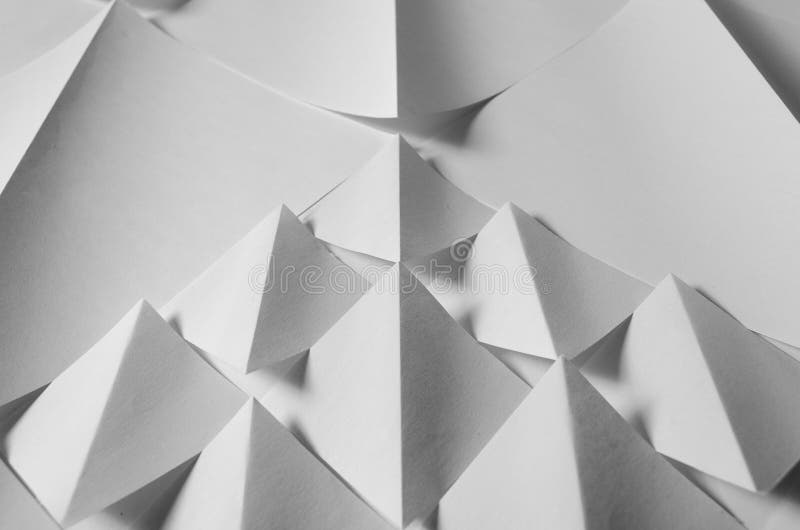 White Paper Folded into Square and Triangular Shapes Stock Photo ...
