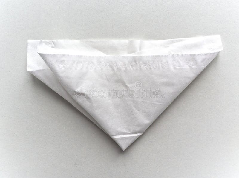 A White Paper is Folded into a Triangle Stock Photo - Image of concept ...