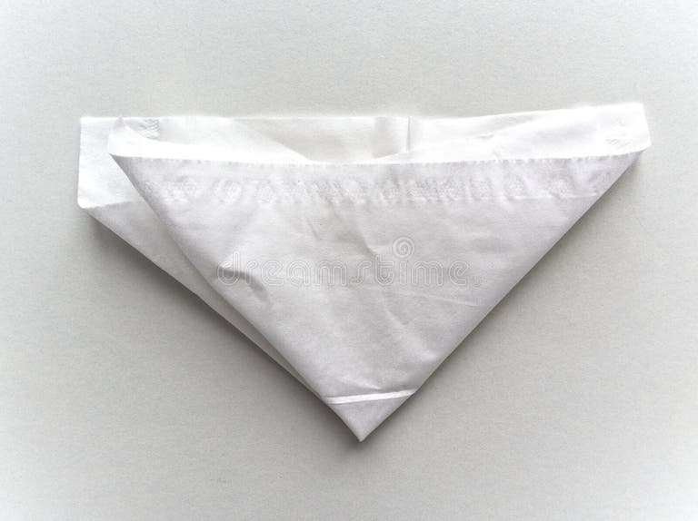 A White Paper is Folded into a Triangle Stock Photo - Image of concept ...