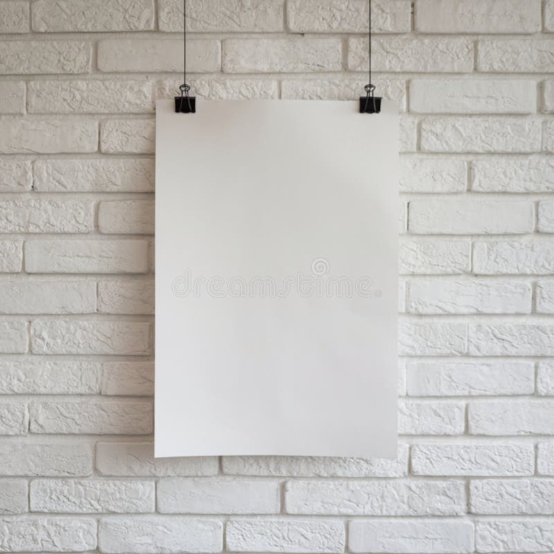 White Paper Hangs from Clips on Textured Brick Wall, Minimalist ...