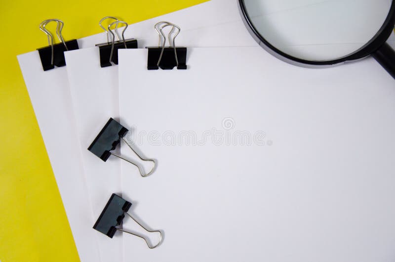 White A4 Paper, Magnifier, Which Lie on Yellow Paper Stock Image ...