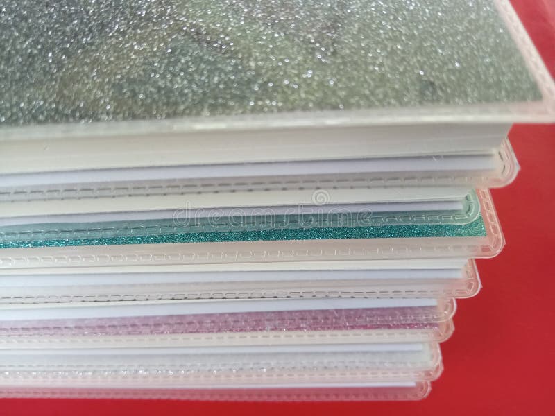 The Gray Face of a Stack of White Paper Notebooks with Plastic Covers ...