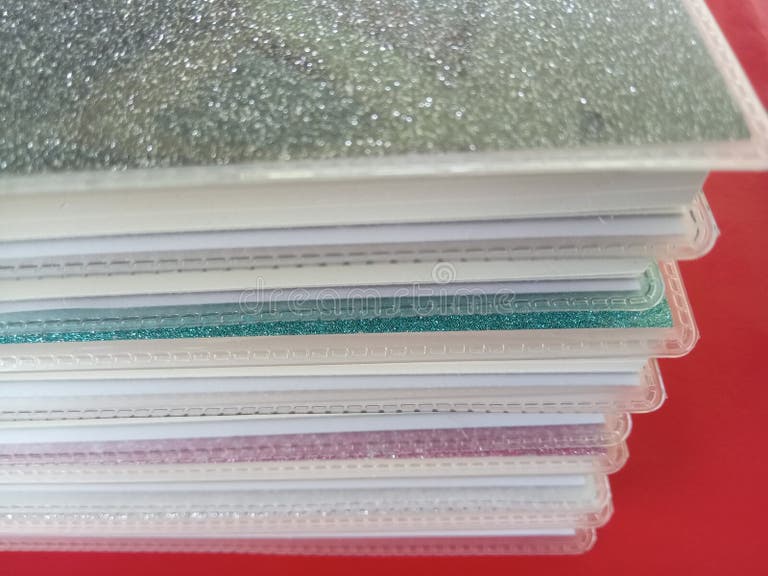 The Gray Face of a Stack of White Paper Notebooks with Plastic Covers ...