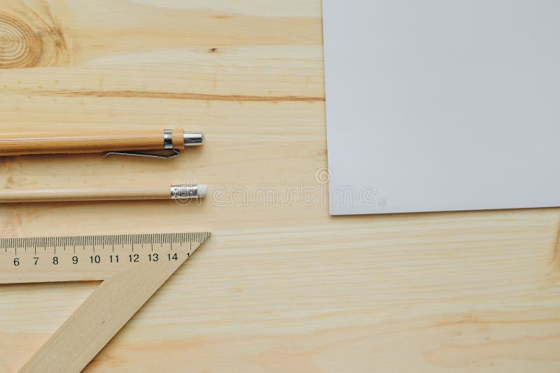 White Paper, Pencil, Pen, Triangle on the Wood Desk in Daylight Stock ...