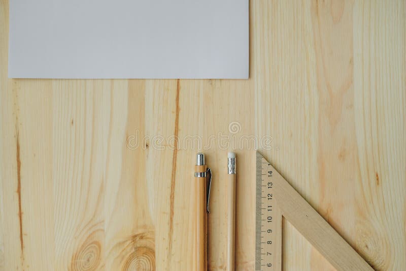 White Paper, Pencil, Pen, Triangle on the Wood Desk in Daylight Stock ...