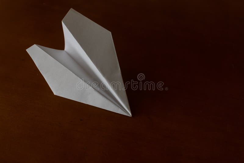 White Paper Plane on Brown Background, Travel and Holiday Concept ...