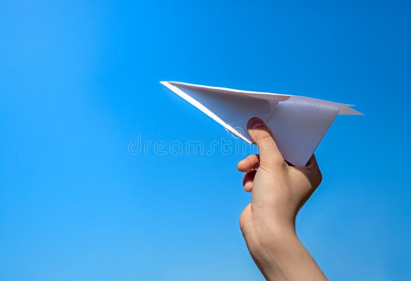 White paper plane in hand stock image. Image of isolated - 147917895