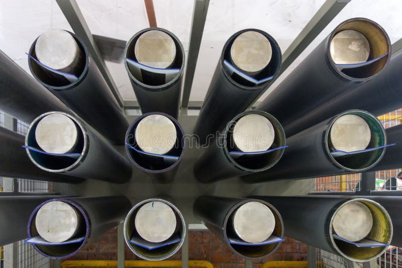 White Paper Rolls in the Metal Tubes at Factory Stock Image - Image of ...