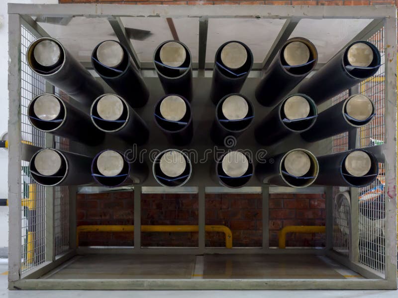 White Paper Rolls in the Metal Tubes at Factory Stock Image - Image of ...