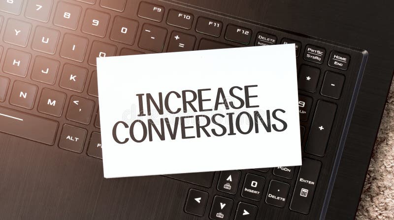 White Paper Sheet with Text Increase Conversions on the Black Laptop ...
