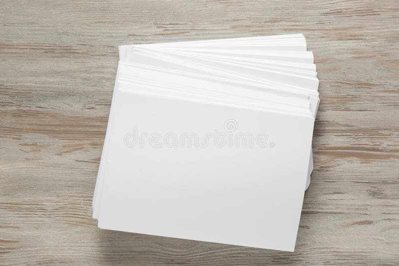 White Paper Sheets on Wooden Table, Top View Stock Photo - Image of ...