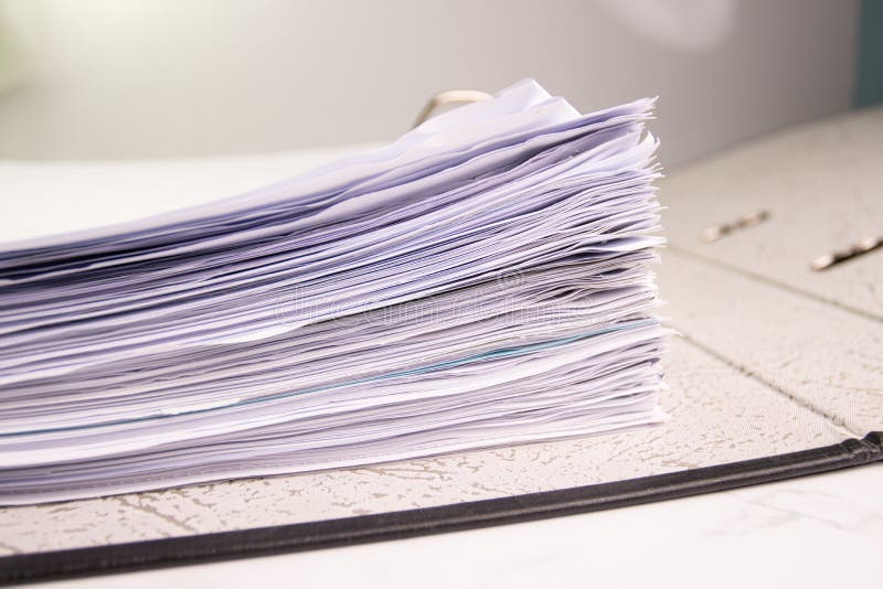 White Paper Stack in Folder File for a Business Contract, Income ...