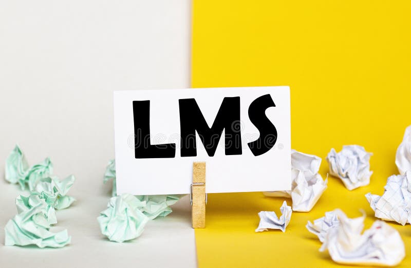 White Paper with Text LMS on a Clothespin on Yellow and White ...