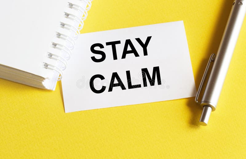 White Paper with Text Stay Calm on a Yellow Background with Stationery ...