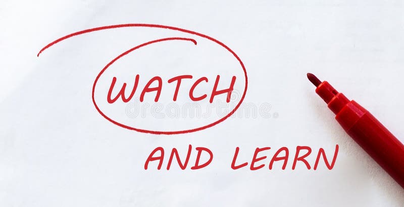 White Paper with Text Watch and Learn on the White with Red Marker ...
