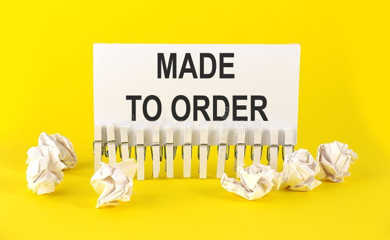 White Paper on the Yellow Background with Text MADE TO ORDER Stock ...