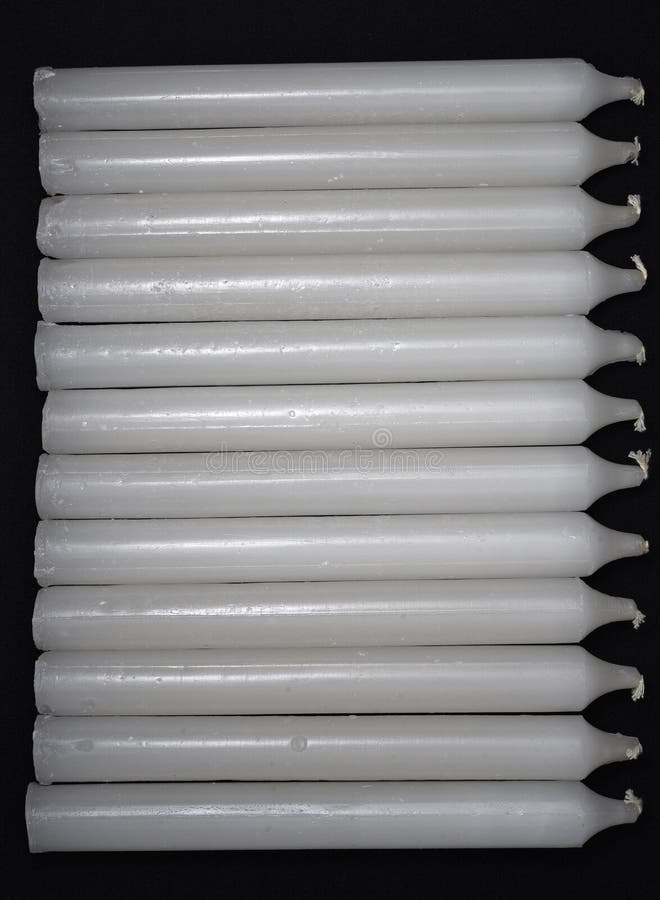 White Paraffin Candles on a Black Background. Household Candles in a ...