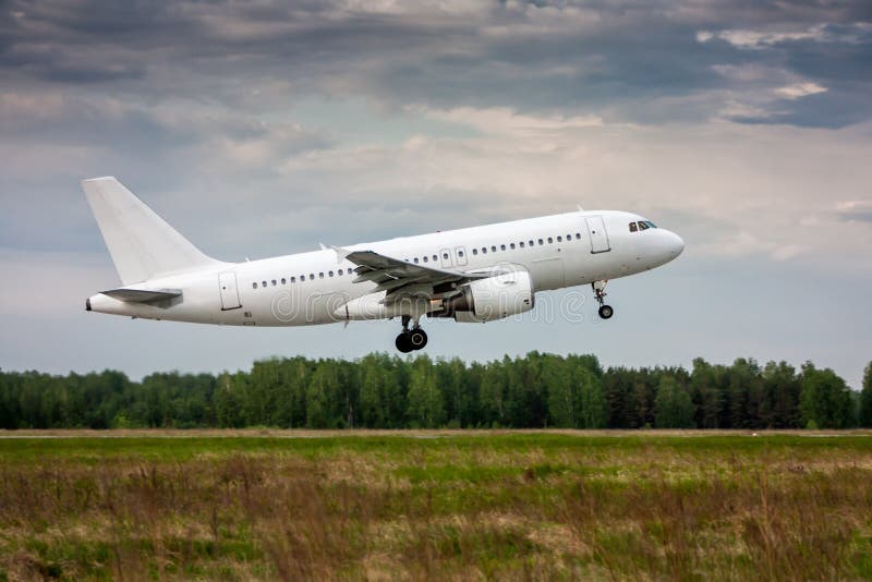 White Passenger Aircraft in the Air on Take-off Stock Image - Image of ...