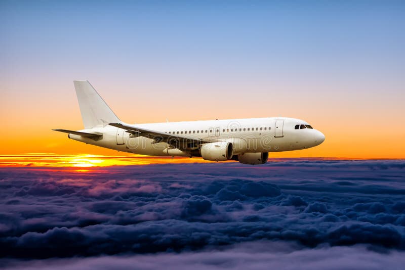 White Passenger Airplane Fly in the Sunrise Sky Stock Image - Image of ...