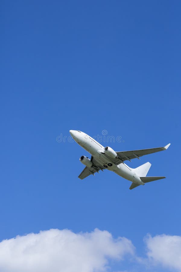 White Passenger Airplane Flying in the Sky Amazing Clouds in the ...
